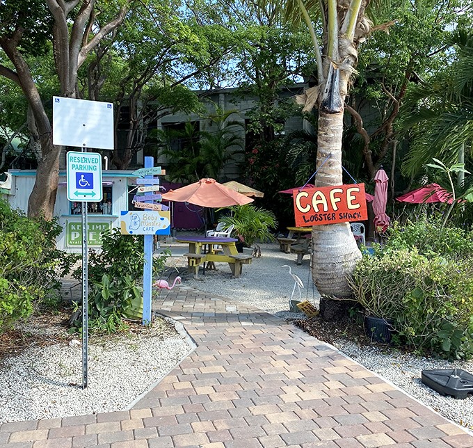 The Lobster Shack Café beckons with tropical charm and the promise of shade – two precious commodities in the Florida sun.