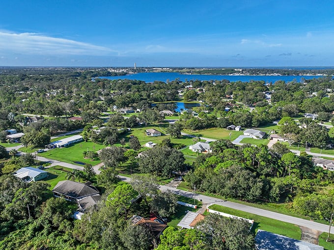 From above, Sebring's neighborhoods reveal their secret—lush greenery surrounding modest homes where your retirement dollars stretch further than your imagination thought possible.