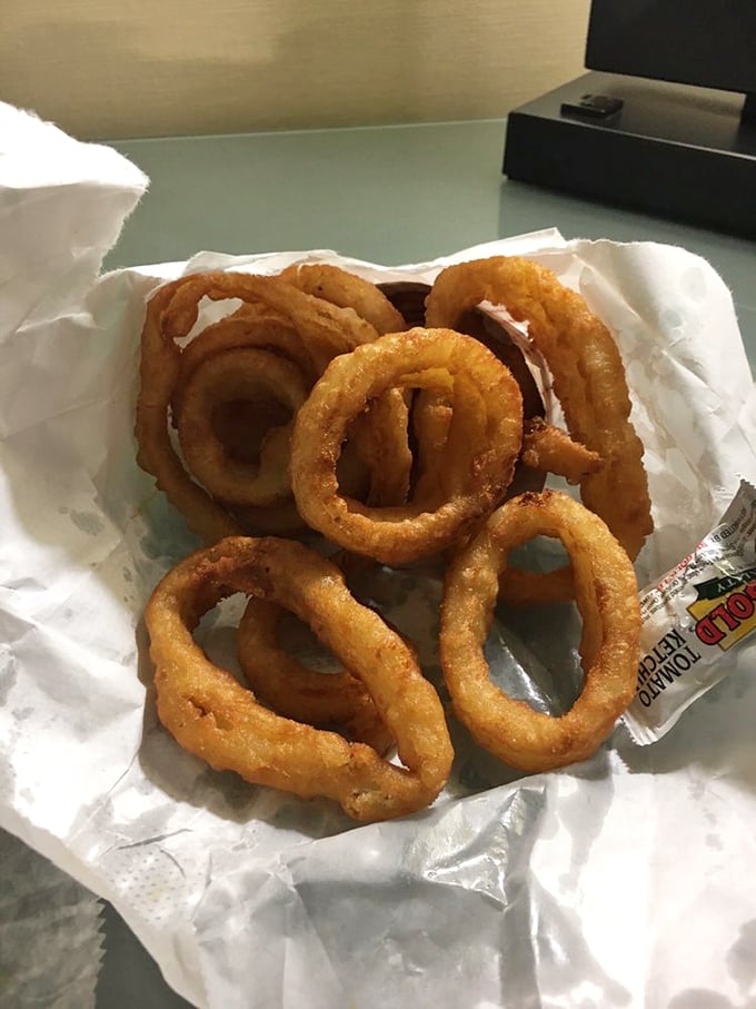 Golden, crispy onion rings that shatter with each bite—the perfect sidekick to those legendary sliders.