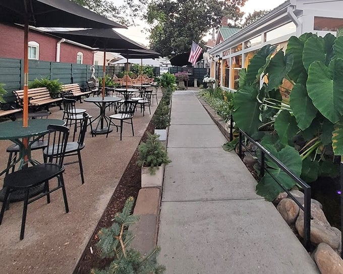 The outdoor seating area offers a peaceful respite between courses, where Nashville breezes carry the scent of magnolias and fried chicken.