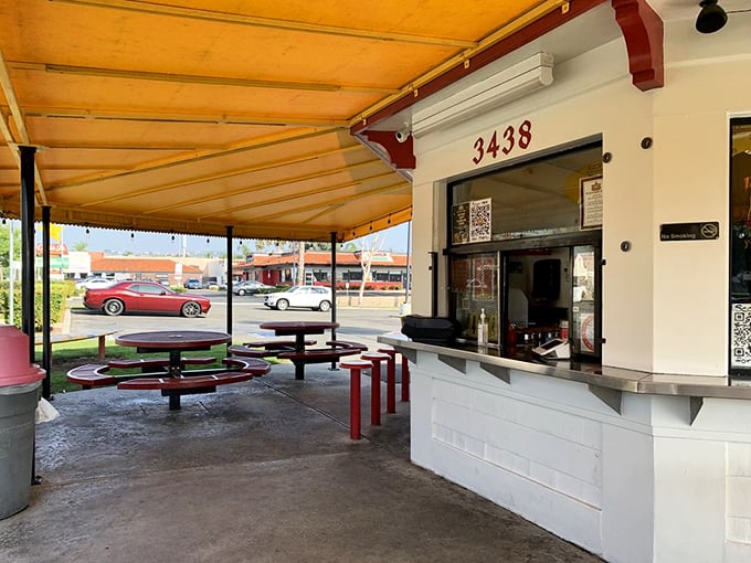 The outdoor seating area—where strangers become friends united by the universal language of "mmm" and "pass the napkins."
