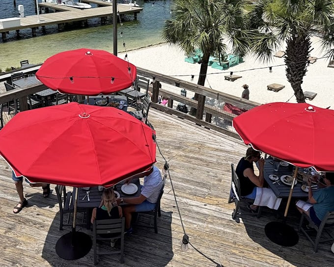 Dining under those crimson umbrellas with sand between your toes—this is what people in landlocked states dream about in February.