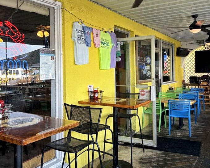 Woody's sunny yellow exterior serves as a beacon for crab cake pilgrims, with colorful chairs inviting you to sit and stay awhile.