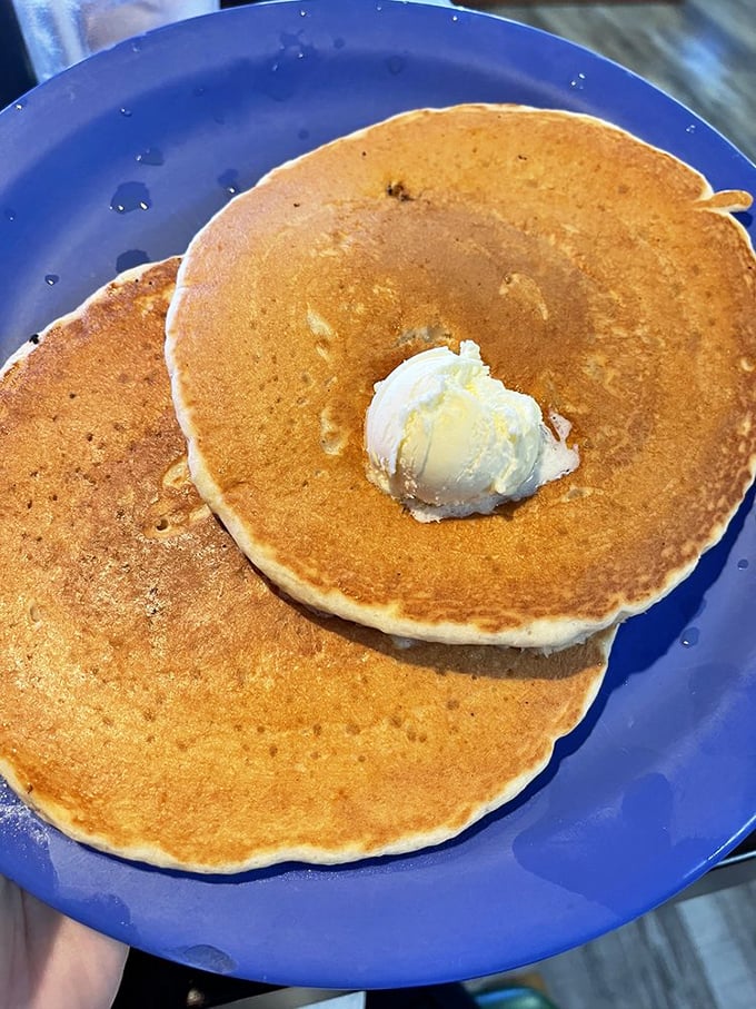 Golden-brown pancakes with a perfect pat of butter melting on top—the breakfast equivalent of hitting every green light on your commute.
