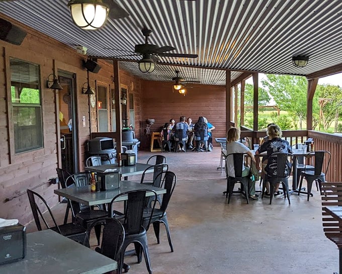 The patio where time slows down and conversations flow easier. Texas sunshine, gentle breezes, and the anticipation of fried catfish—pure bliss.