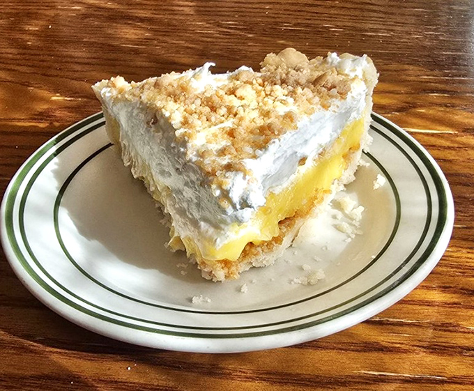This isn't just pie—it's a cloud of banana cream heaven with a graham cracker foundation. Dessert engineering at its finest.
