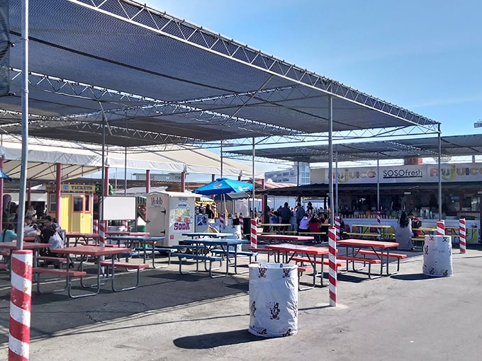 The market's food court – where picnic tables become community gathering spots and the real treasures are the conversations shared.