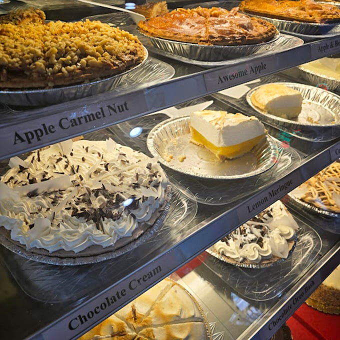 The pie display case—where dreams are stacked in neat rows. Like a museum where everything is edible and nothing costs admission.