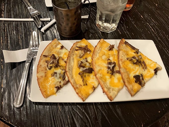 Flatbread that's been blessed by the cheese gods and kissed by savory pot roast—proof that good things come in thin packages.