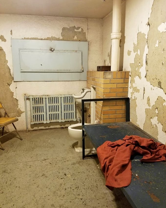 Home sweet home? Not quite. This cell's accommodations—a thin mattress, exposed toilet, and zero privacy—remind us how far correctional facilities have evolved.
