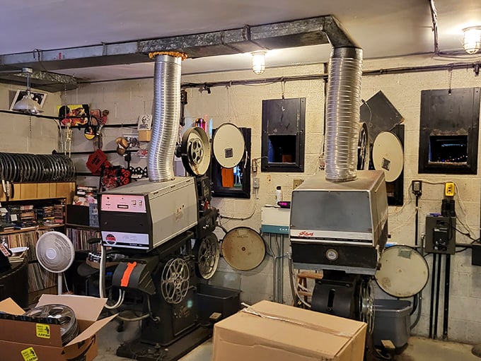 The projection room houses the beating heart of the Mahoning – vintage 35mm projectors still spinning celluloid dreams.