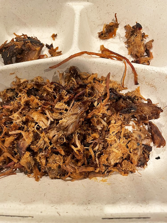 Behold the pulled pork in its natural habitat – tender, bark-flecked, and ready to make you question why you ever ate anything else.