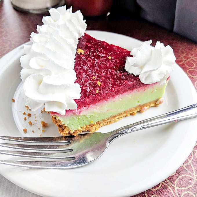 This raspberry key lime pie doesn't need a filter – it's already wearing its Sunday best with that whipped cream tiara.
