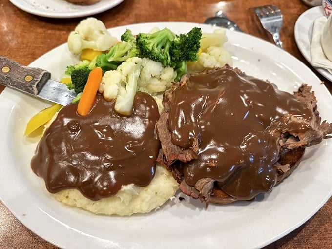 Pot roast that doesn't just fall apart – it practically surrenders to your fork, smothered in rich gravy that your mashed potatoes will thank you for.