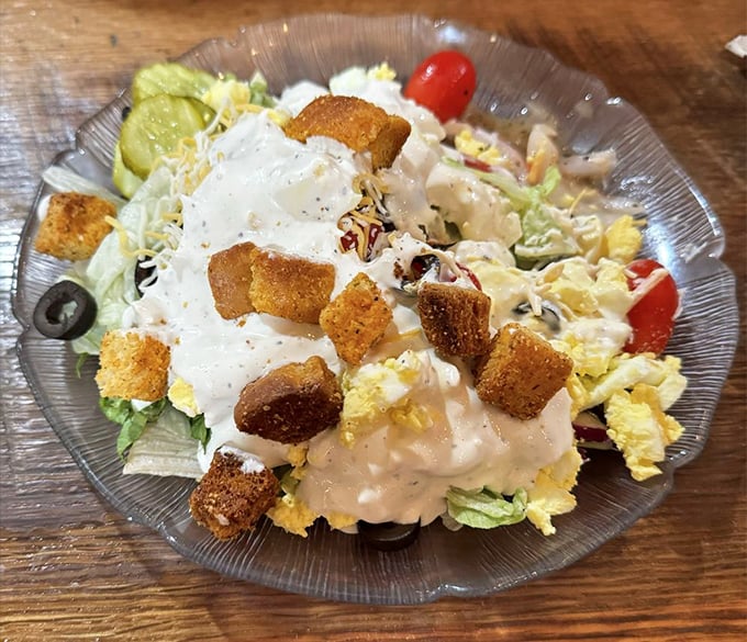 A salad that doesn't apologize for being at a barbecue joint. Fresh, crisp, and loaded with enough goodies to make vegetable-dodgers reconsider their life choices.