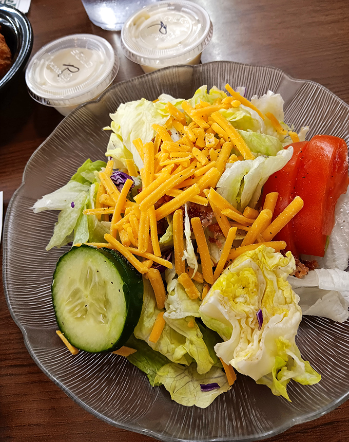 A salad that actually satisfies – crisp, colorful, and cheese-topped. This isn't rabbit food; it's what rabbits dream about eating.