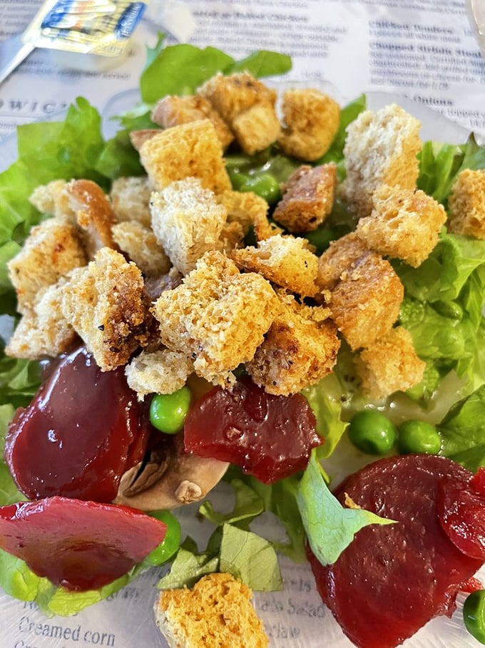 This isn't just any salad—it's a colorful canvas of fresh greens, vibrant beets, and homemade croutons. Even salad skeptics might be converted.