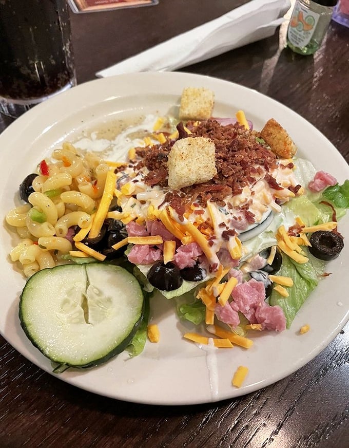 Even the salad plate tells a story of abundance—pasta salad, garden greens, and enough toppings to make a rabbit jealous.