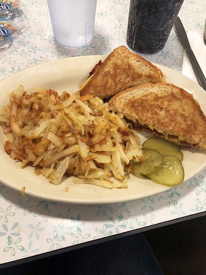 The humble grilled cheese and hash browns—proof that sometimes the simplest combination delivers the most profound satisfaction. Childhood comfort with grown-up execution.