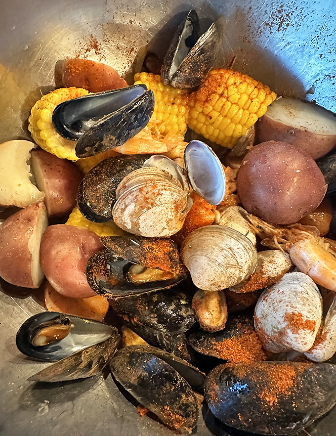 The seafood boil that launched a thousand napkins! Mussels, clams, corn, and potatoes swimming together in seasoned harmony—a beautiful mess worth making. 