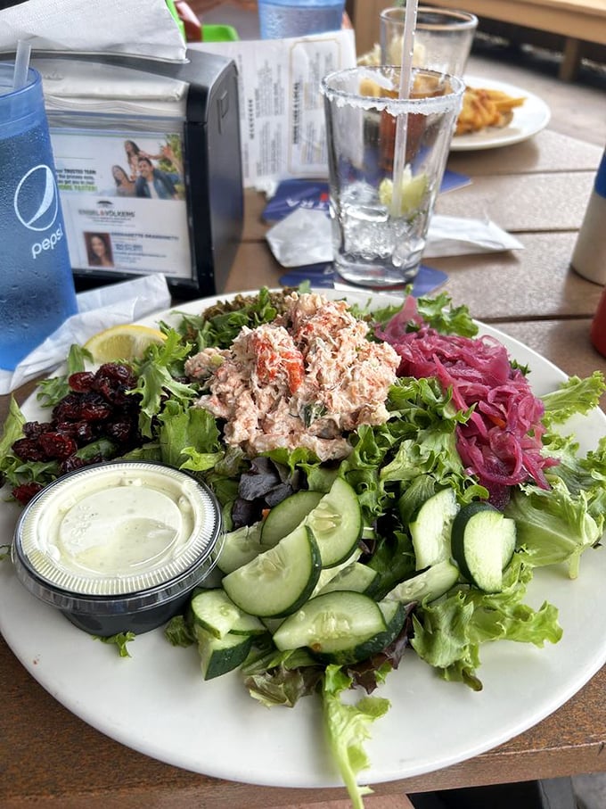 A seafood salad that proves healthy eating doesn't mean punishment – fresh greens, cucumber, and seafood create a vacation on a plate.