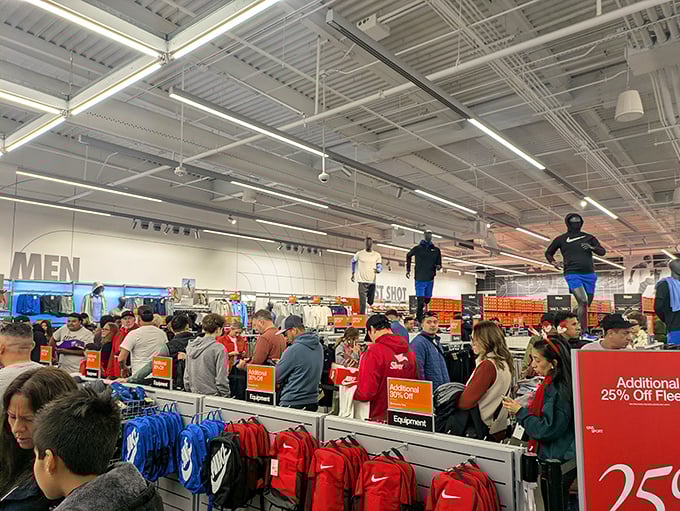 The Nike Factory Store during a sale is retail's version of the Oklahoma land rush—strategic shopping at its most competitive. 