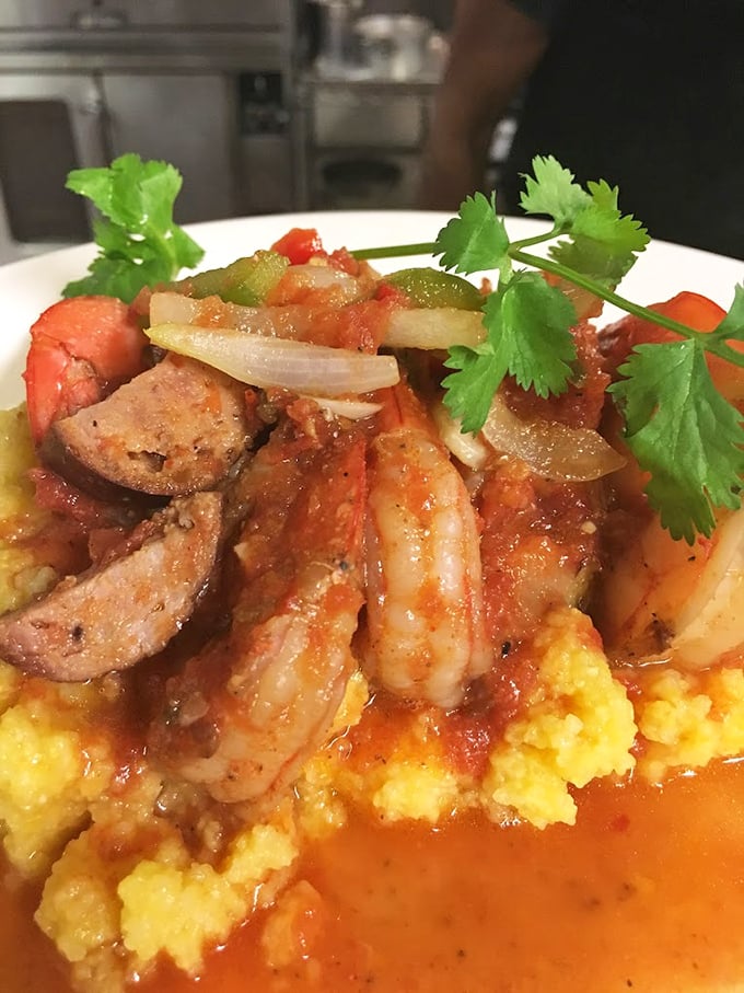 Shrimp and grits – a Southern classic that makes you wonder why anyone would eat oatmeal when this exists. Those yellow grits look like sunshine on a plate.