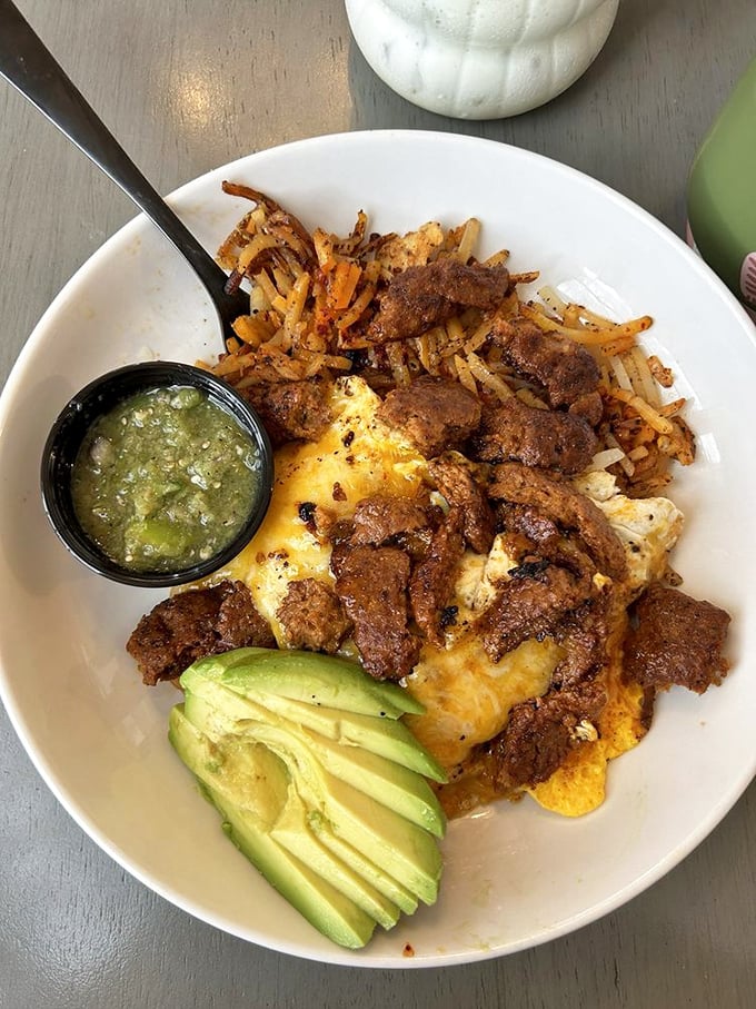 A breakfast bowl that means business—crispy potatoes, perfectly seasoned protein, and that avocado fan that says "someone cares about your Instagram."