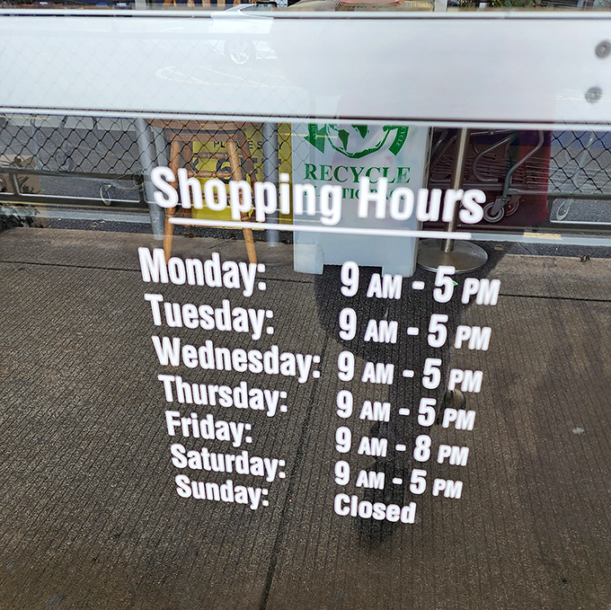 The store hours sign—your roadmap to thrifting nirvana. Note Friday's extended hours, perfect for post-work retail therapy sessions.