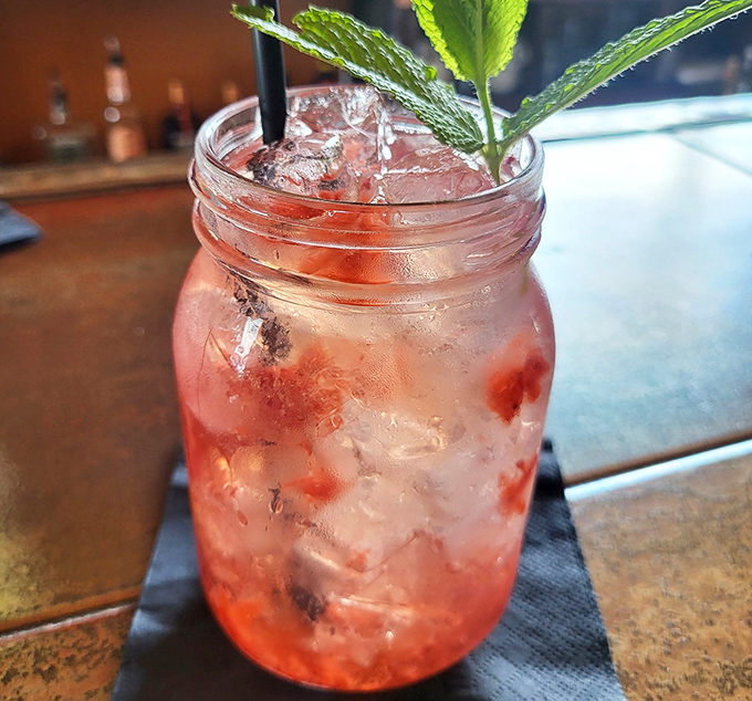 A strawberry mojito that tastes like summer vacation in a mason jar – refreshing, bright, and dangerously easy to enjoy.