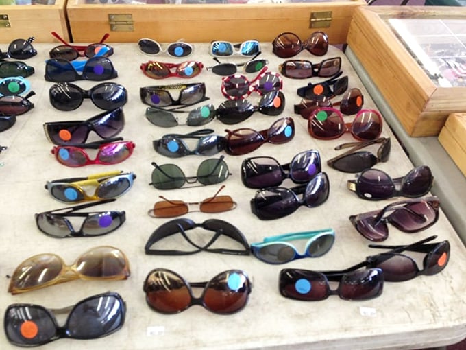 Sunglasses galore! Designer knockoffs and genuine finds mingle together like guests at a Florida pool party, waiting for their next adventure.