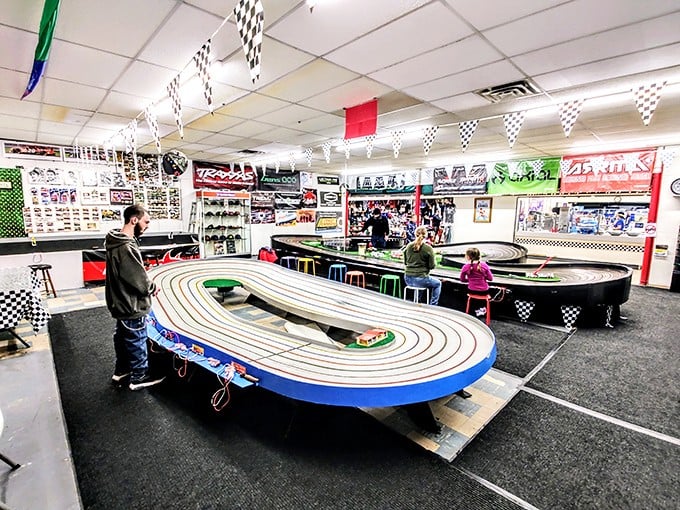 Slot car racing heaven where adults pretend they're shopping "for the kids" while secretly reliving their childhood glory days.