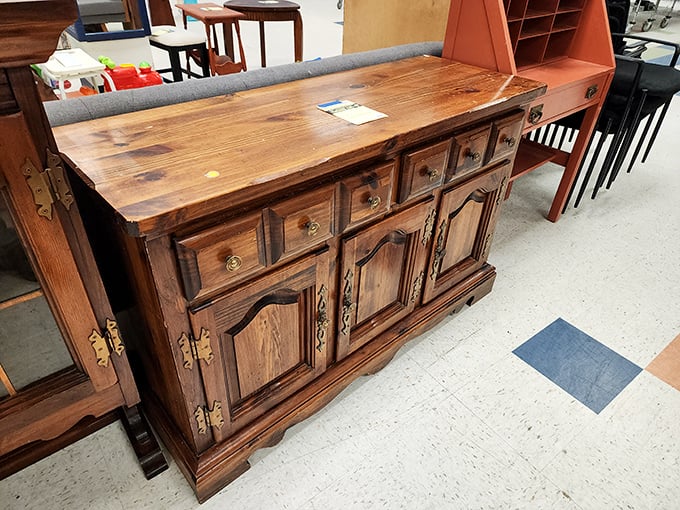 This isn't just a wooden sideboard—it's a time capsule of craftsmanship that survived the great furniture purge of someone's downsizing adventure.