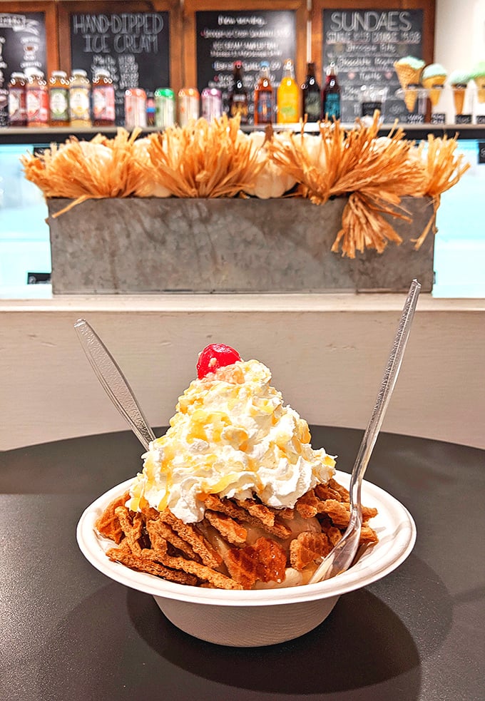 This isn't just dessert—it's performance art with whipped cream, crunchy toppings, and a cherry standing ovation.