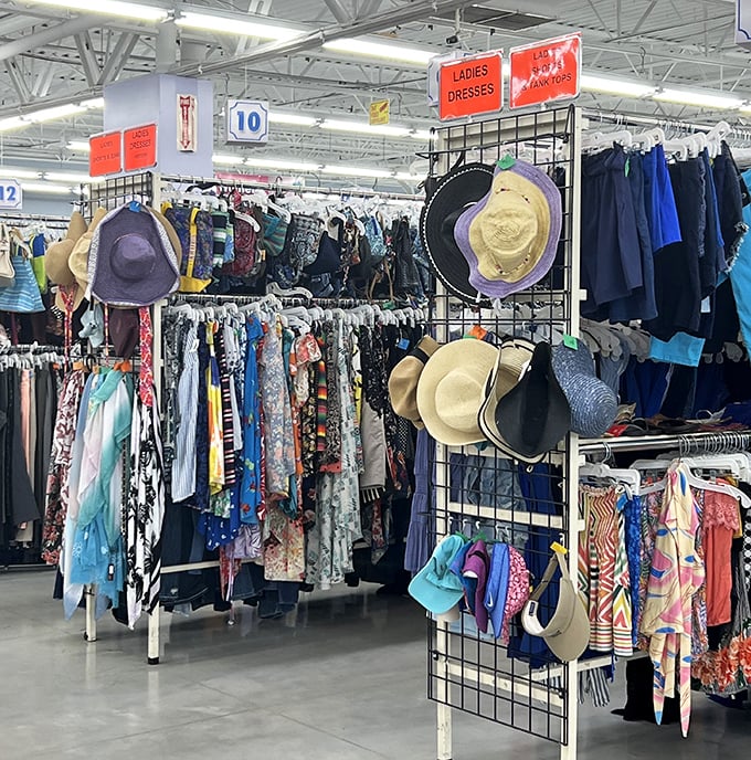 The ladies' dress section: a kaleidoscope of patterns where yesterday's fashion becomes tomorrow's statement piece. Those sun hats are ready for their second act.