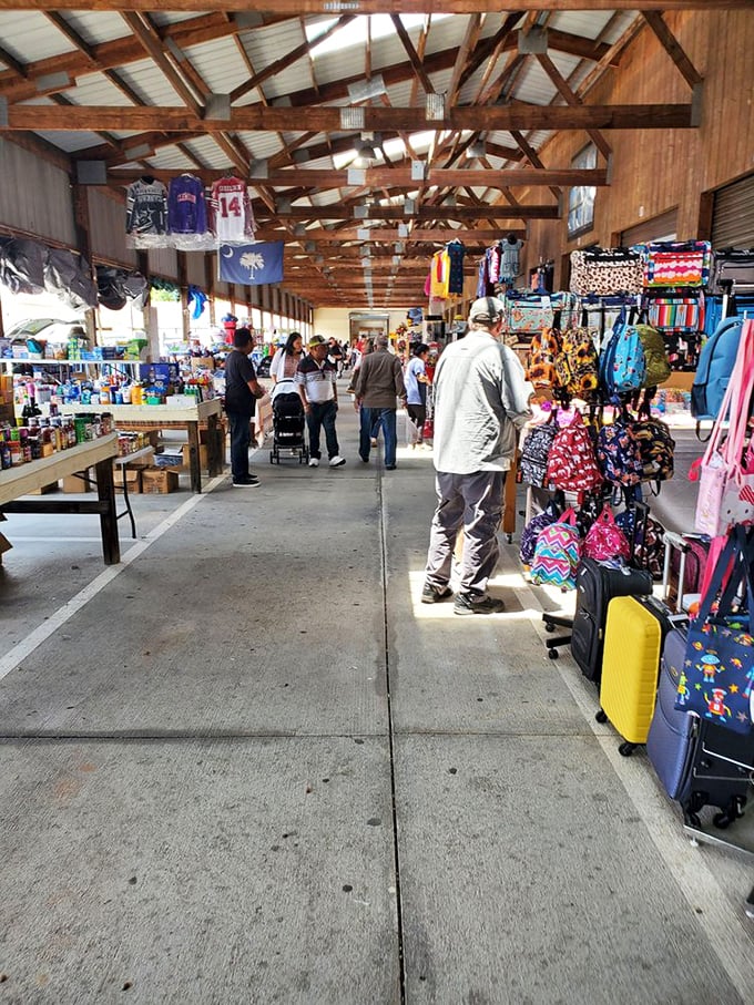 Outdoor stalls buzz with weekend energy as vendors and customers create flea market magic together.