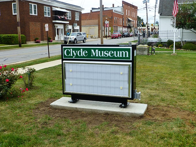 Clyde's museum sign stands ready to share stories as rich as the affordable housing market here.