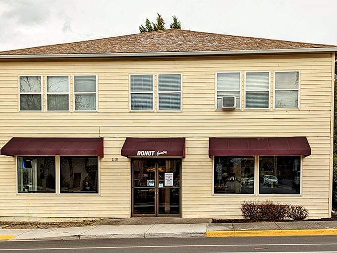 Donut Country's rustic beige building with its vintage sign has been satisfying Medford's sweet tooth for years. The drive-thru sign promises convenience for donut emergencies.