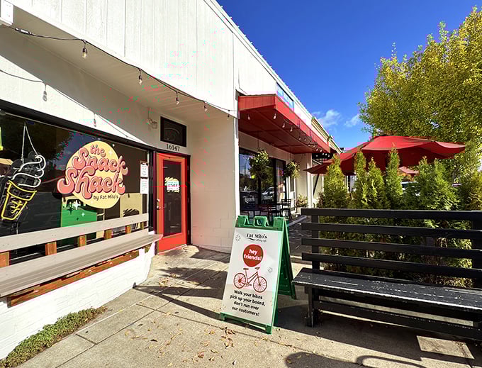 Red umbrellas and outdoor seating suggest this place knows how to make breakfast feel like a celebration.