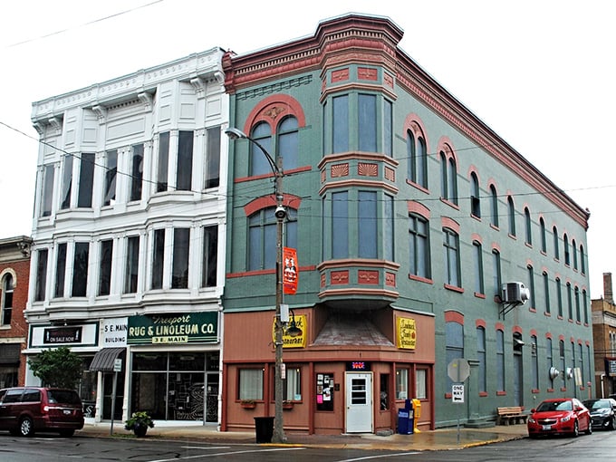 Freeport's architectural odd couple—white bay windows meet green brick corner—creating a streetscape more interesting than most buddy comedies on Netflix.