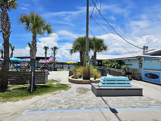 Palm trees, blue skies, and a sign pointing to seafood paradise. JB's Fish Camp is Florida in restaurant form.