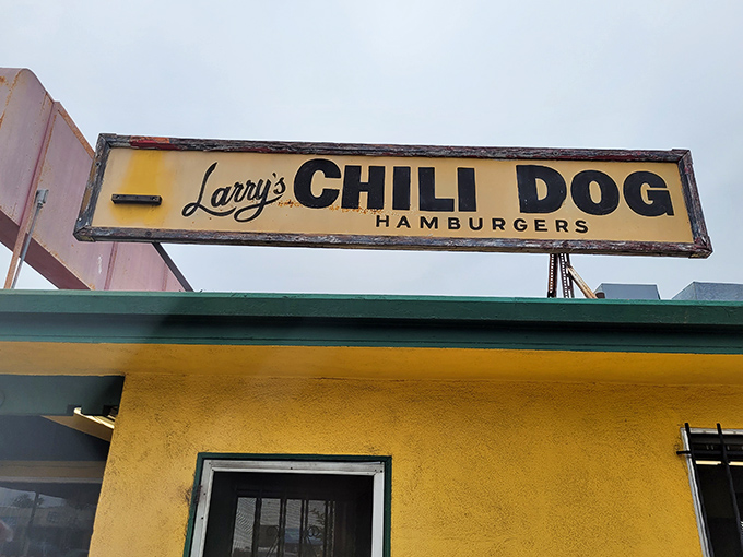That classic yellow facade and vintage sign promise old-school chili dog perfection – and absolutely deliver every time.