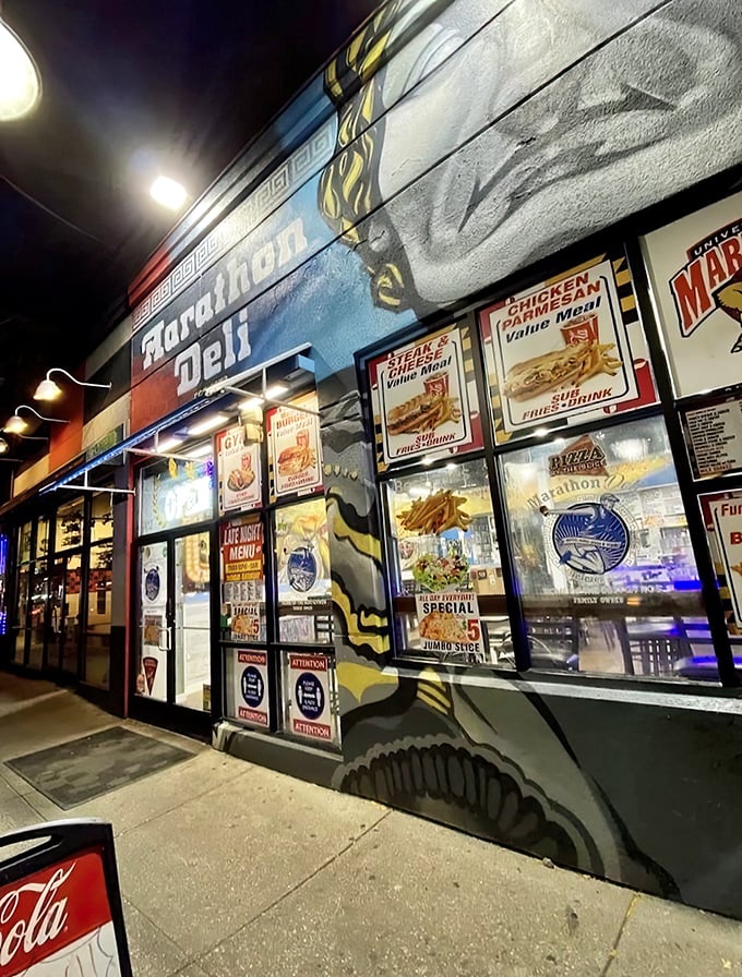 Marathon Deli's vibrant storefront lights up the night like a beacon for the sandwich-obsessed. Late-night cravings, solved.