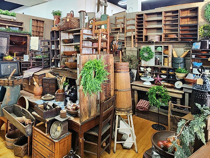 Wooden shelves stacked with vintage treasures create a wonderfully organized chaos—like grandma's kitchen if she collected everything.