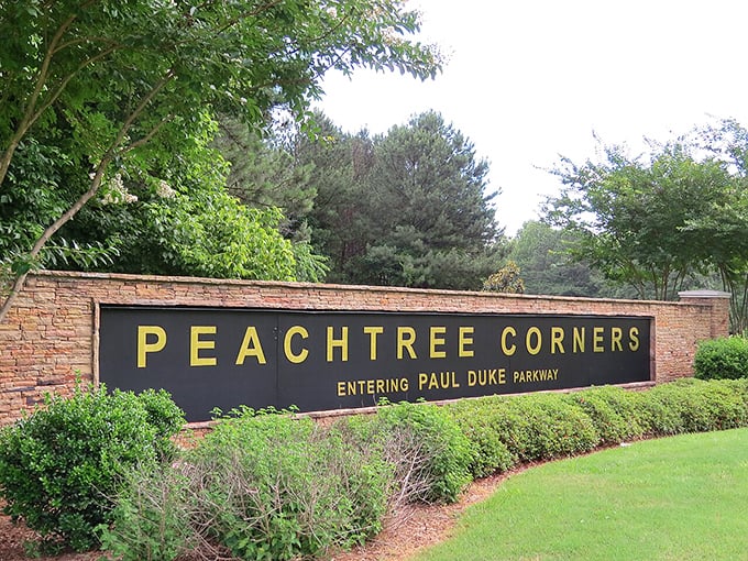 "PEACHTREE CORNERS" announces itself like Georgia royalty! This entrance sign promises Southern hospitality with a side of Paul Duke Parkway pride.