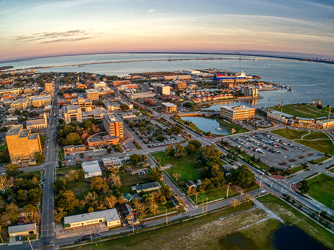Pensacola's waterfront view stretches to forever, where palm trees frame a postcard you get to live in.