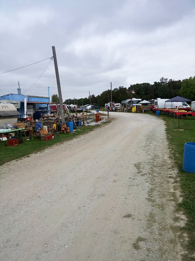Rutledge Flea Market spreads across the countryside like a temporary village. Rural charm meets bargain hunting on this dirt path.