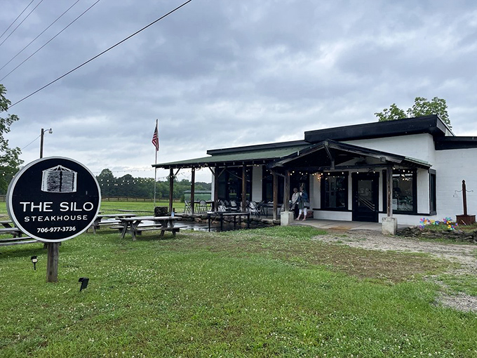 The Silo Steakhouse looks like it was plucked from a Norman Rockwell painting – complete with porch, flag, and promise of home-cooked goodness.
