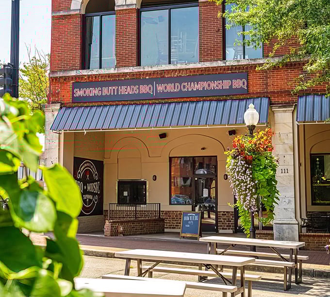 Smoking Butt Heads' brick façade and flower baskets – where barbecue meets unexpected charm.