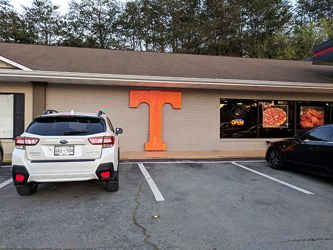 That giant orange "T" isn't just Tennessee pride—it's a landmark for pizza lovers. Follow the T to taste sensation.